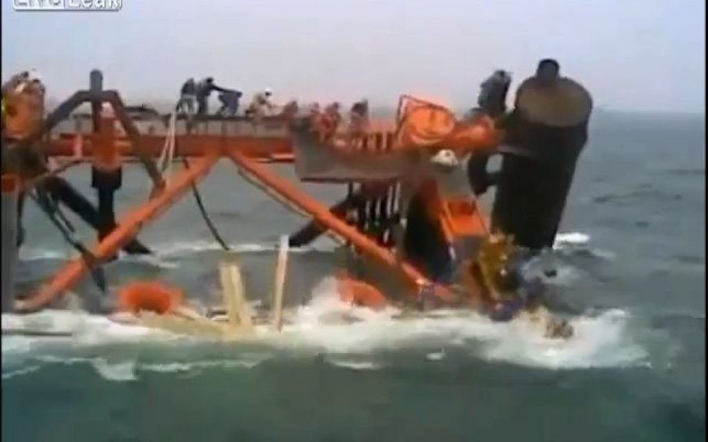 Iranian oil workers seen fleeing sinking platform | The Times of Israel