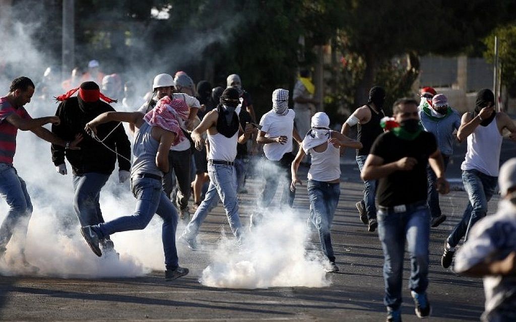 Israelis attacked, car set on fire during riots in Arab Israeli towns ...