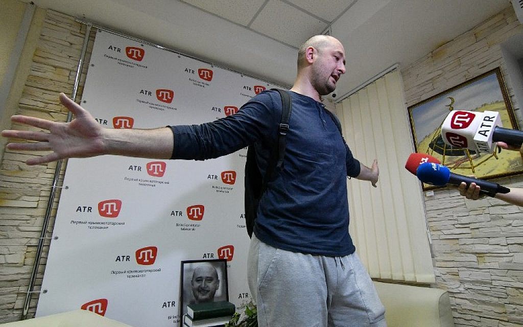 Covered in pig's blood, Russian journalist played dead all the way to ...