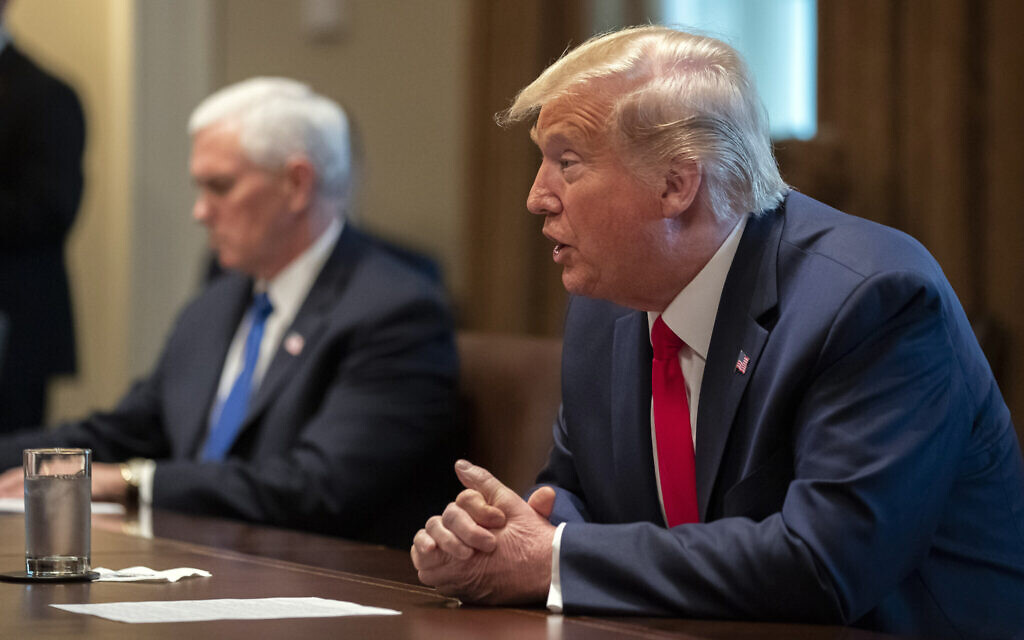 Trump signs $100 billion coronavirus relief package | The Times of Israel