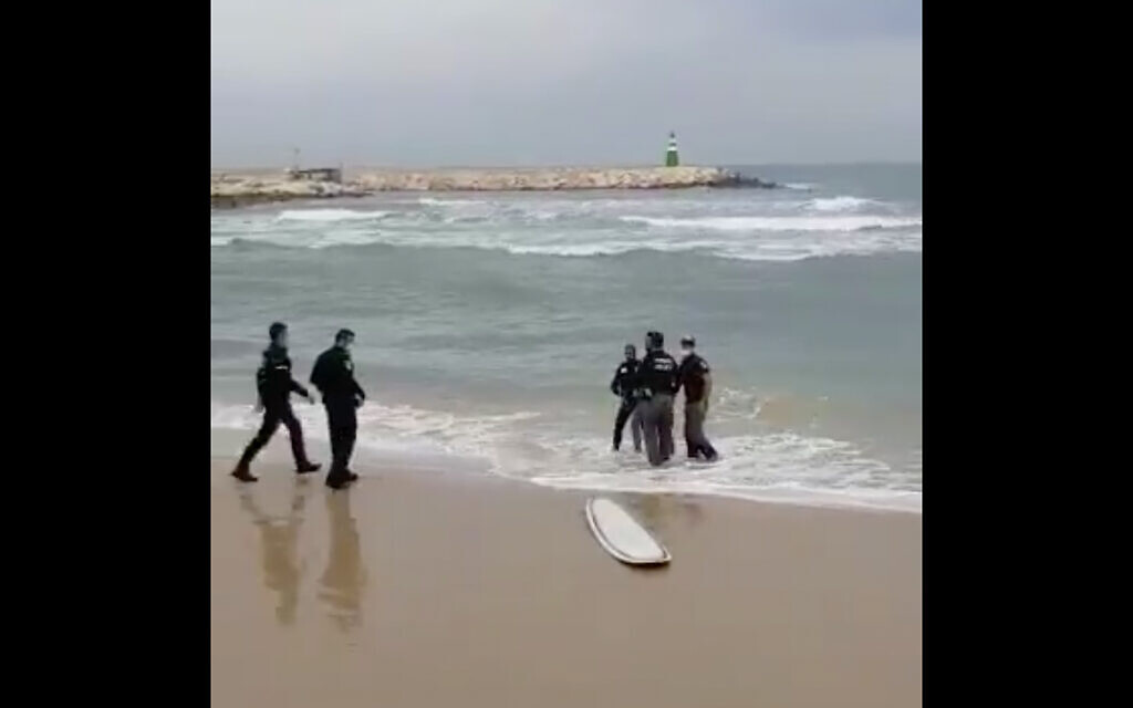 Watch: Police swarm Tel Aviv surfer said to refuse to leave water | The ...