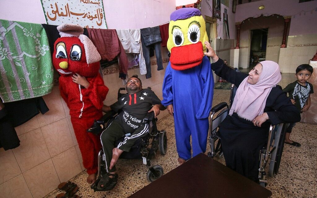 Disabled Gaza couple make dolls, costumes to give their children ...