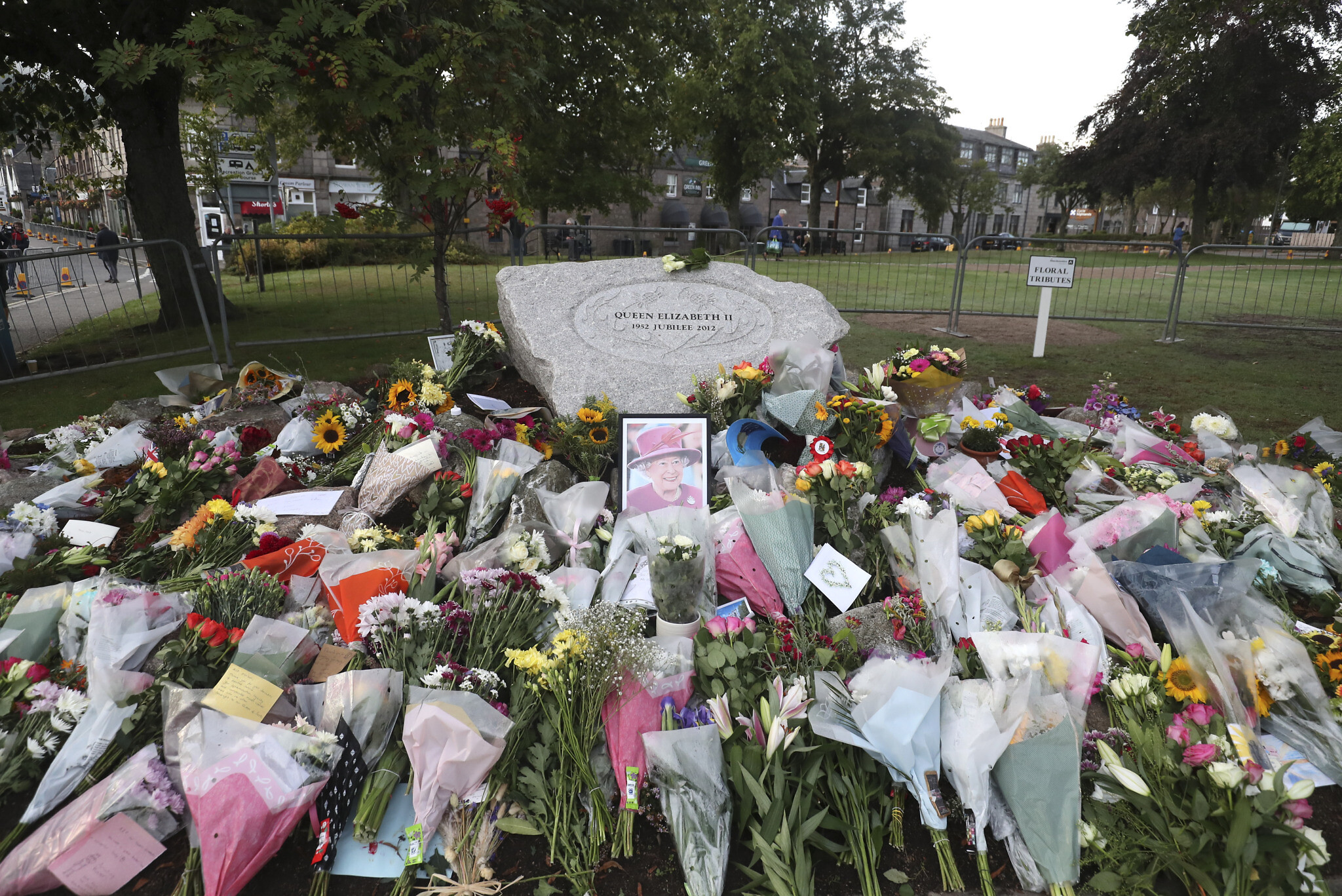 Thousands line Scottish streets as Queen Elizabeth's coffin begins ...