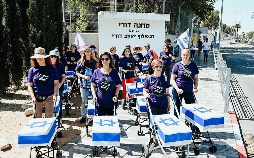 Mothers push strollers bearing coffins in protest outside IDF Induction ...