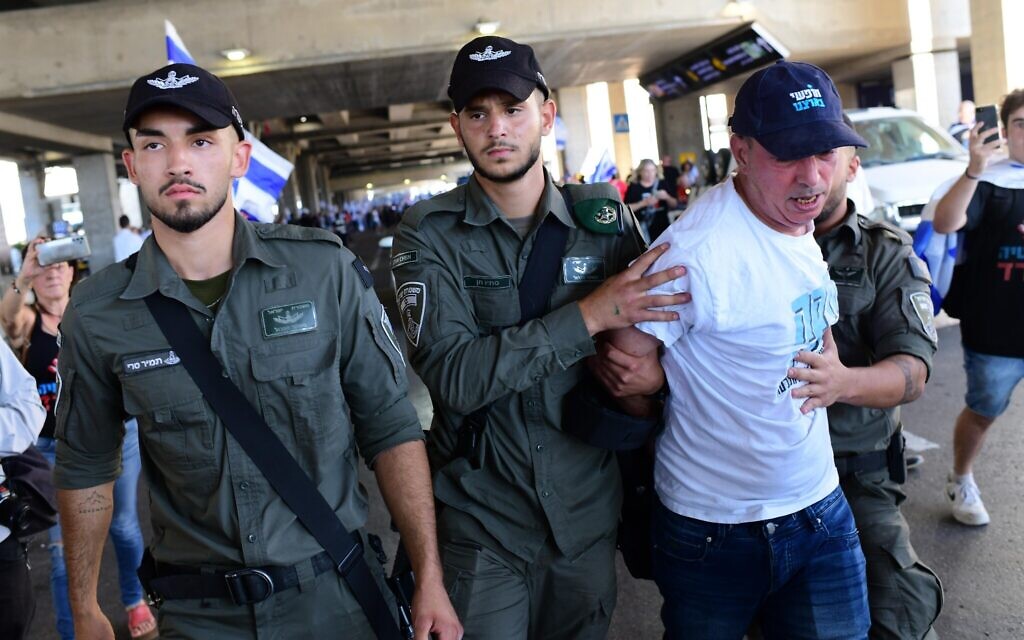 Police: 15 protesters arrested at airport in 'uncompromising ...